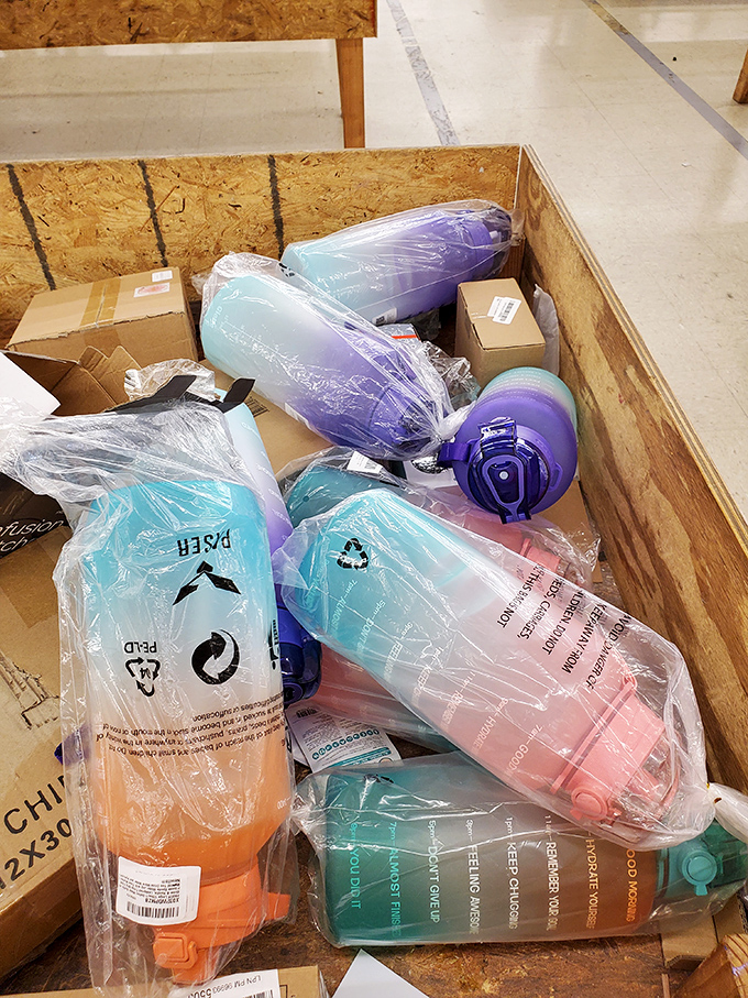 Colorful tumblers and water bottles stand at attention, ready for new homes. Hydration never looked so good or cost so little.