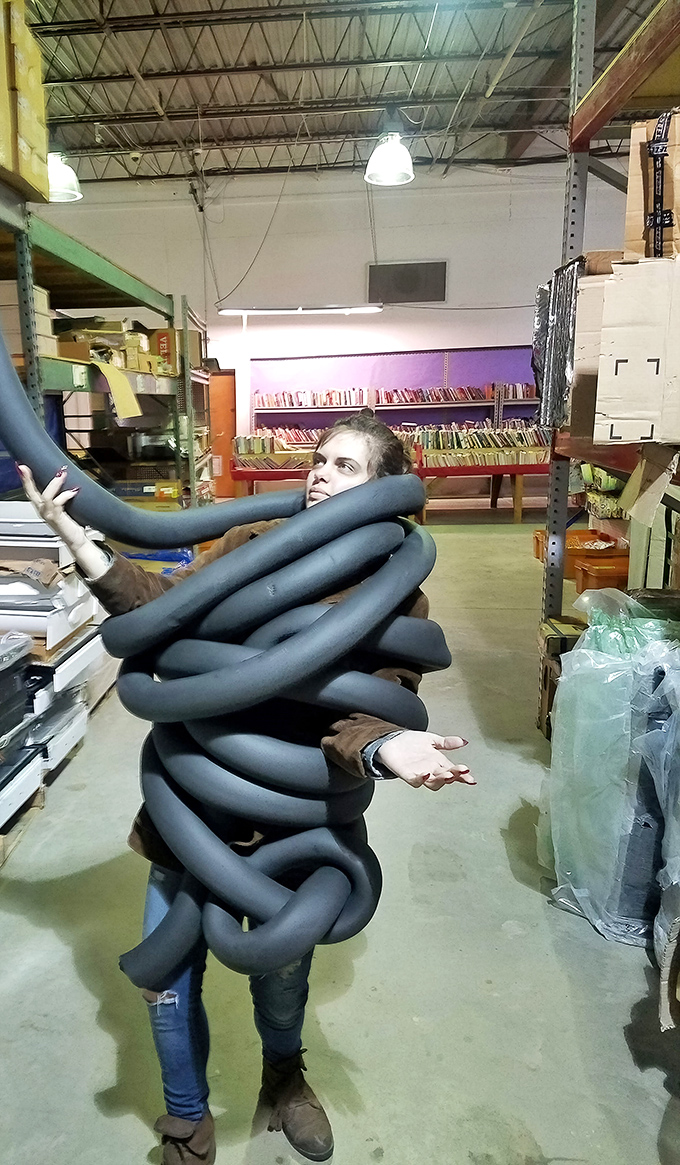 A shopper demonstrates the true spirit of Mike's: dive in, get wrapped up in the possibilities, and emerge victorious with unexpected finds.
