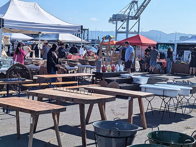 The San Francisco skyline provides a dramatic backdrop for treasure hunting at the Alameda Point Antiques Faire.