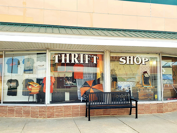 Ellis Community Thrift Shop's charming vintage storefront window displays colorful treasures that beckon you to step back in time.