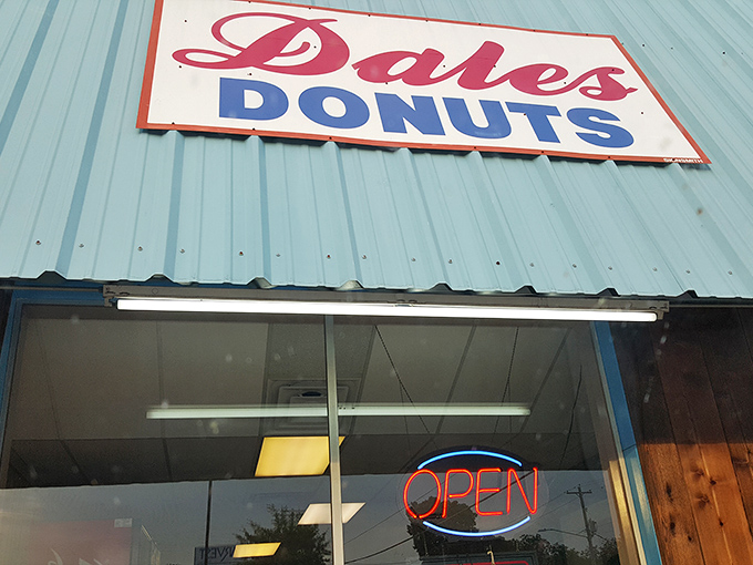 The glowing "OPEN" sign in the window is the bat signal for donut lovers – summoning sweet-toothed heroes from across town.