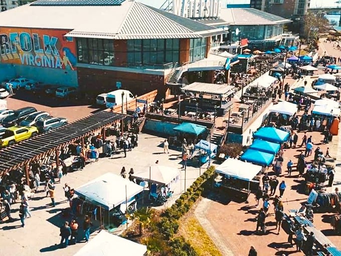Fashion finds under blue skies! Norfolk's outdoor market displays vintage clothing with flair, turning secondhand shopping into a stylish adventure.