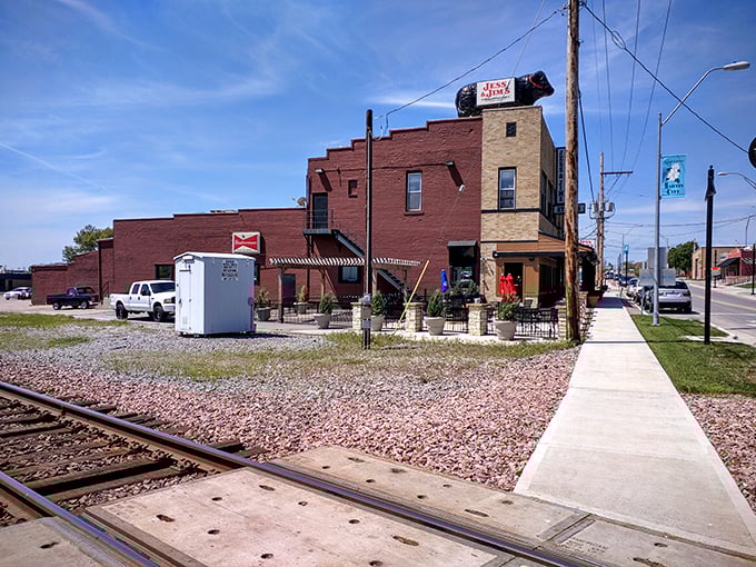 Railroad tracks and brick walls—the unpretentious setting for what many consider the pinnacle of KC steak perfection.