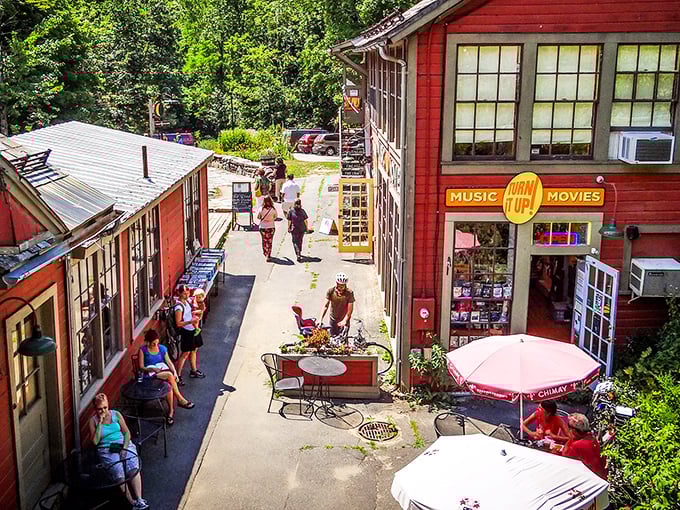 The red buildings of Montague create a vibrant backdrop for community gatherings, where locals debate whether it's "Turn-ers" or "Turner's" Falls.