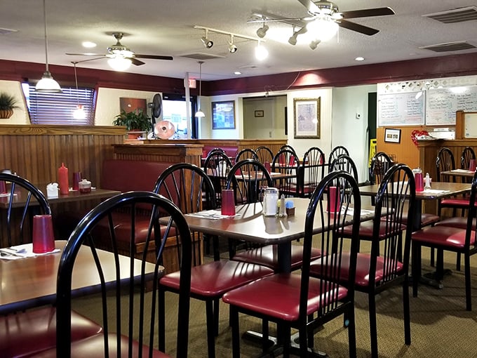 Wooden chairs await inside Silver Spoon, ready to support you through a feast of classic Carolina comfort food.