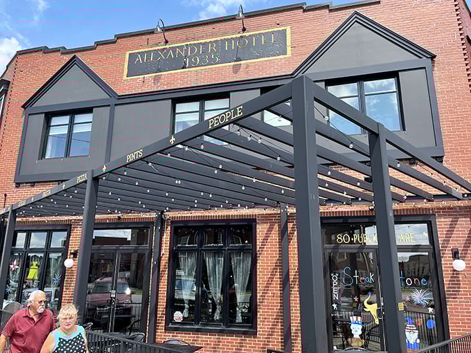 Steak & Stone's modern awning contrasts with historic brick. Like finding an old friend with a stylish new haircut – familiar comfort with contemporary flair.