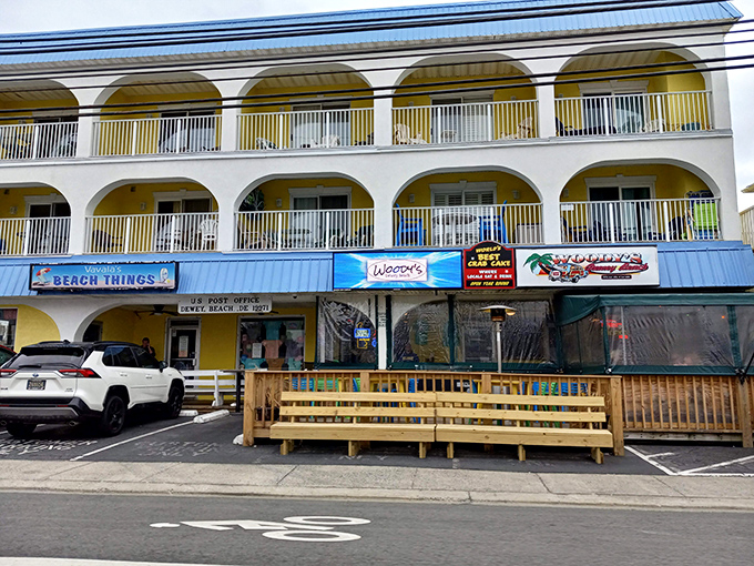 Hidden among beach shops, Woody's colorful awning signals the spot where crab cake dreams come true without the white tablecloth fuss.
