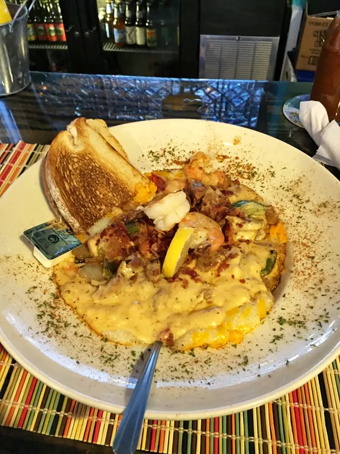 Coastal comfort on a plate. That toasted biscuit stands ready to soak up every last drop of the sauce you'll be dreaming about tomorrow.