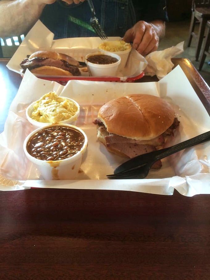In the sandwich world, this is royalty. Brisket nestled in a soft bun with sides that don't compete—they complement, like a well-rehearsed jazz quartet.