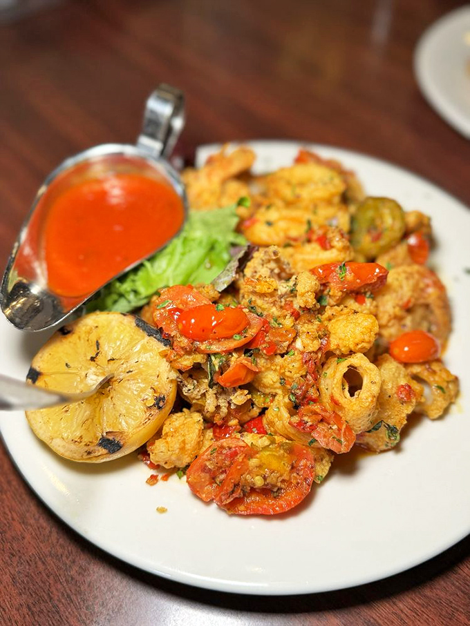 Calamari that doesn't require a wrestling match to chew, paired with plump shrimp and colorful vegetables. The ocean called – it's jealous.