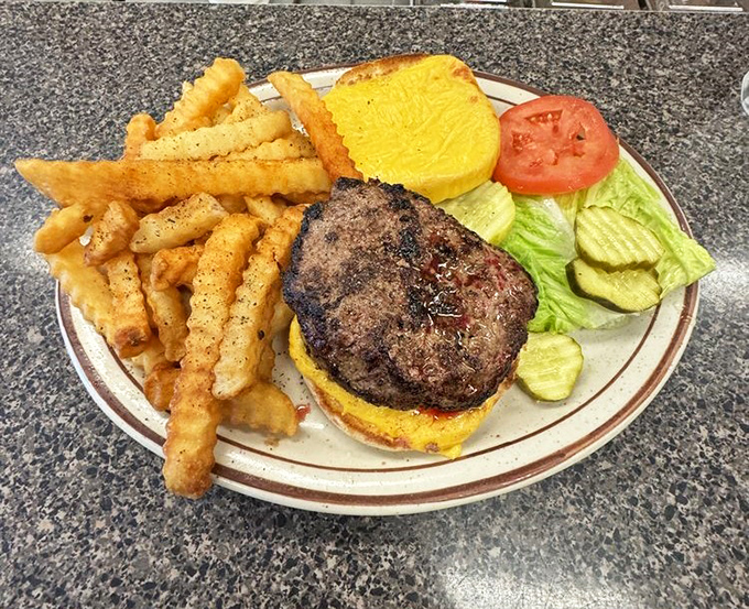 A burger that doesn't need hashtags or filter effects to impress—just honest cooking and a side of perfectly golden fries.