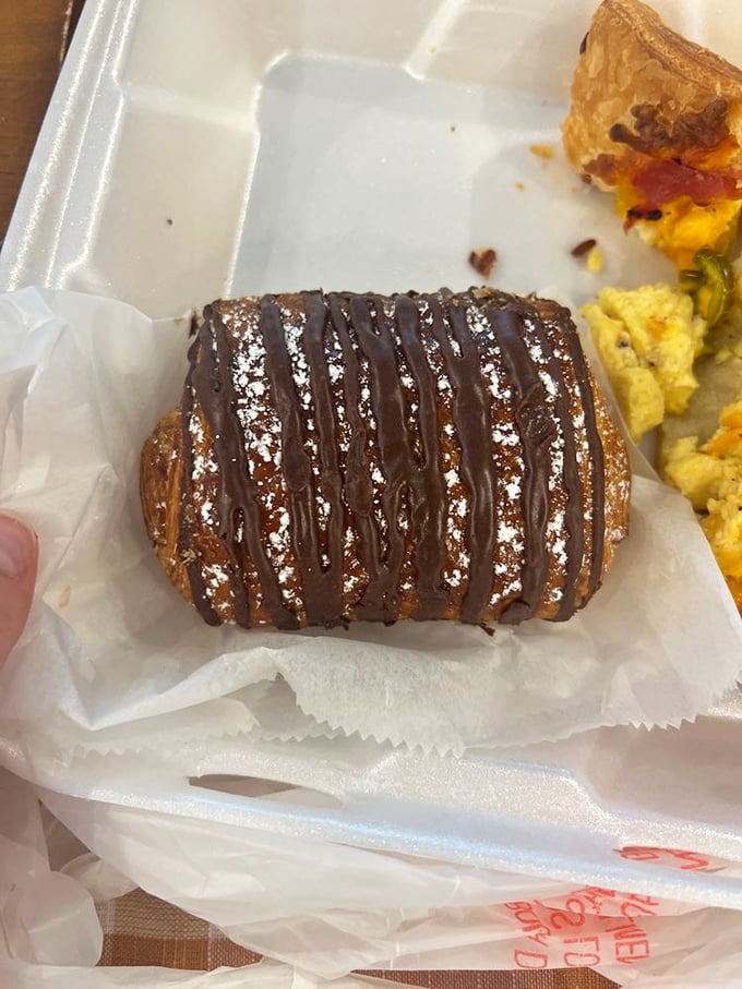 Chocolate drizzle on flaky pastry—a breakfast that makes Monday feel like Saturday. This croissant doesn't need a passport to transport you to Paris.