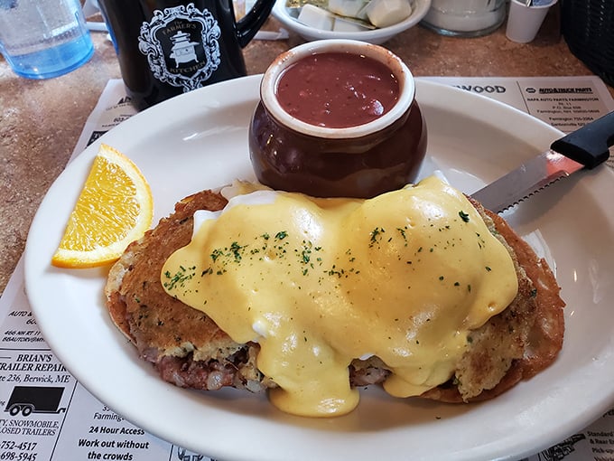 Eggs Benedict getting cozy with a side of strawberry jam—a breakfast romance that would make Julia Child swoon with delight.