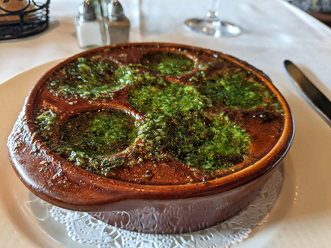Escargot swimming in herb-flecked butter is the culinary equivalent of trying on someone else's glasses—strange at first, then suddenly everything becomes clear.