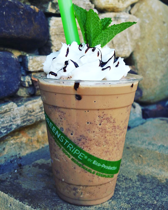 Whipped cream mountains, chocolate drizzle rivers, and a mint leaf flag planted at the summit. This frappe isn't just a drink—it's a dessert expedition.