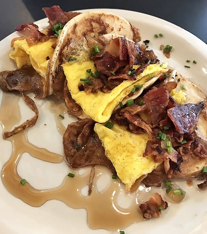 Breakfast tacos that prove tortillas deserve morning glory too. Scrambled eggs and bacon nestled in French toast battered flour tortillas—genius!