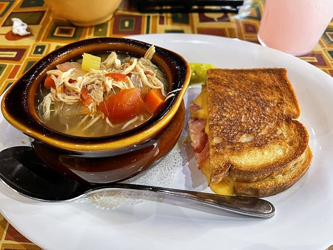 Not just soup and sandwich—it's comfort in a bowl paired with a grilled cheese that would make your childhood self weep with joy.