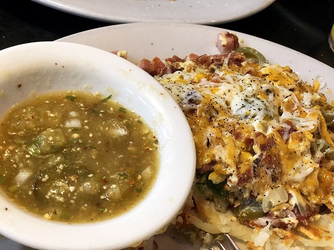 This isn't just a plate of food—it's a delicious archaeological dig through layers of hash browns, salsa verde, and melted cheese.