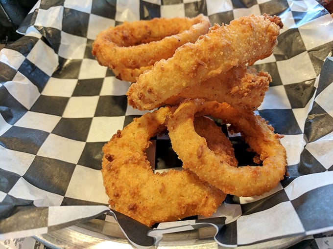 Golden, crispy onion rings that crunch like autumn leaves—except these leaves make you smile instead of having to rake them.