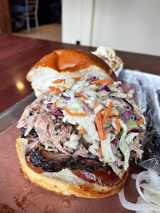 This isn't just a sandwich; it's an engineering marvel. Pulled pork, slaw, and sauce stacked so perfectly it belongs in the Smithsonian.