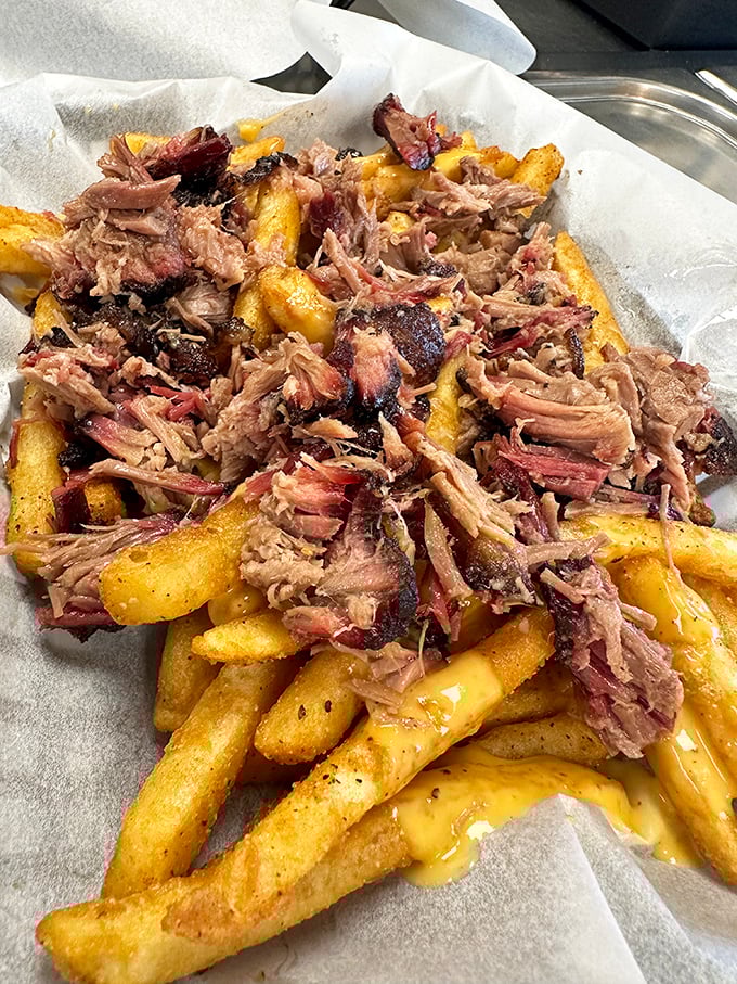 Pulled pork fries—because sometimes your comfort food needs its own comfort food. The cheese sauce is just nature's way of saying "you deserve this."
