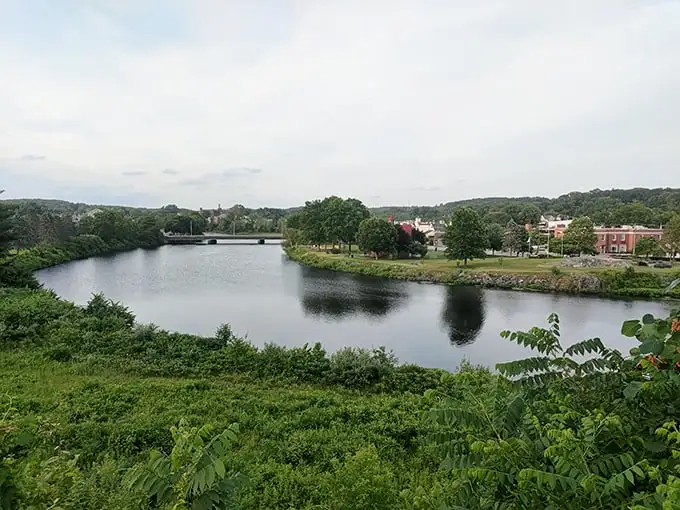 The Quinebaug River doesn't just flow through Putnam—it defines it. Water views that would cost millions elsewhere come standard here.