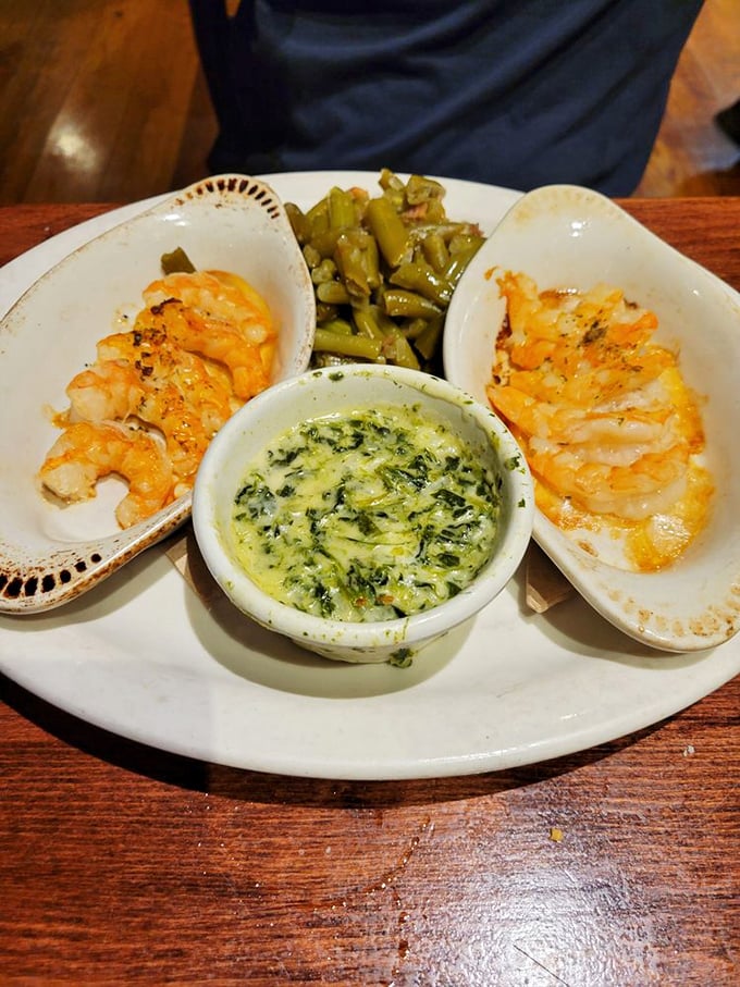 These scampi aren't just swimming in sauce—they're doing the backstroke in buttery, herby heaven while green beans keep watchful company.