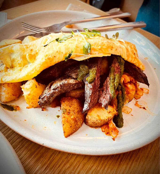 This steak and eggs situation is the breakfast equivalent of showing up to a casual Friday in a tuxedo—dramatically overdressed and absolutely worth it.