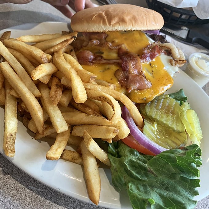 When a burger has been cut in half and still looks this impressive, you know you're in for a religious experience of beef and melted cheese.