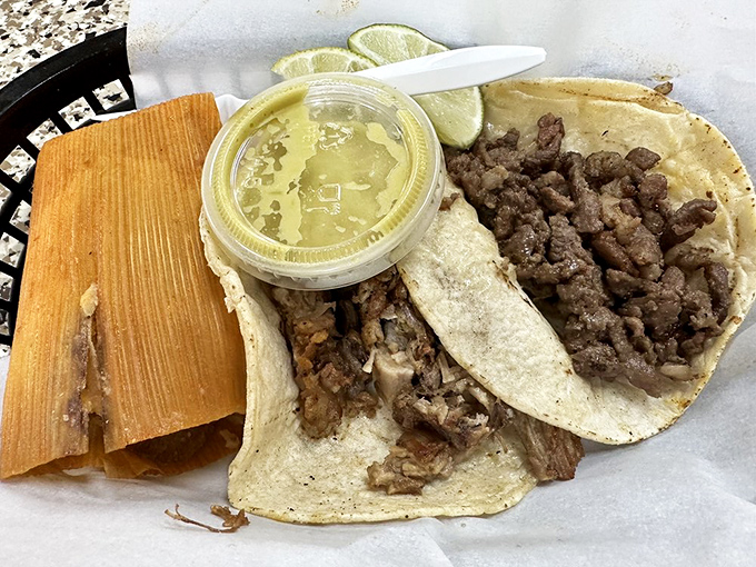 The tamale and taco carnitas combo—proof that some of life's greatest pleasures come wrapped in the humblest packages.