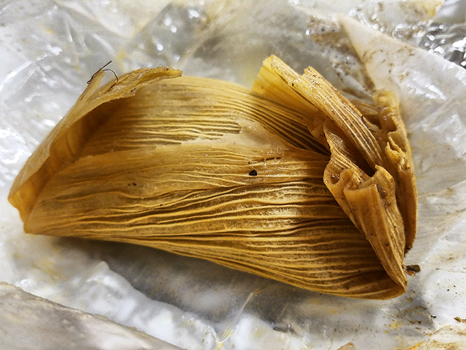 Unwrapping a tamale is like opening a present you already know you'll love—corn husk exterior, masa treasure within.