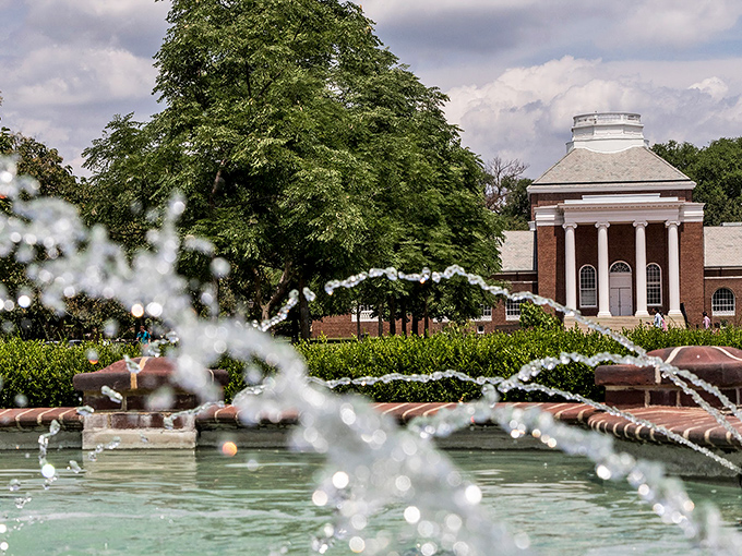 Classical columns and dancing fountains create a timeless atmosphere at the University of Delaware, where history and innovation coexist beautifully.
