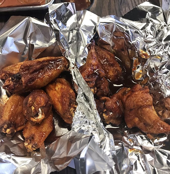 These wings have clearly been introduced to smoke and fire in the most intimate way—crispy, glazed, and absolutely irresistible.
