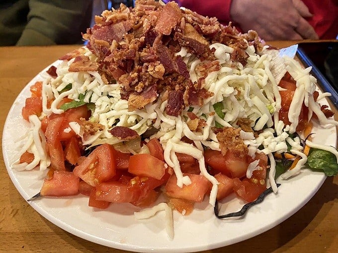 A salad that doesn't apologize for wearing bacon like a crown. The cheese-to-tomato ratio here is mathematical perfection.