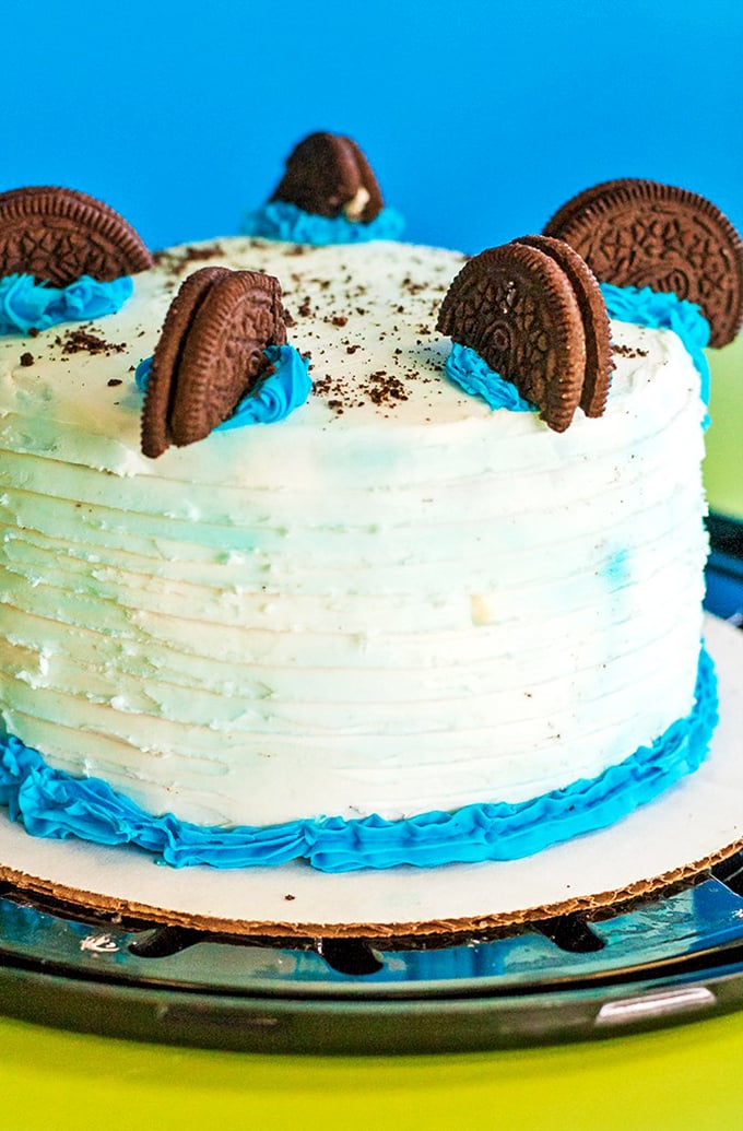This isn't just a cake; it's an Oreo dream team with cookies standing at attention in pools of blue frosting, ready to make birthday wishes come true.
