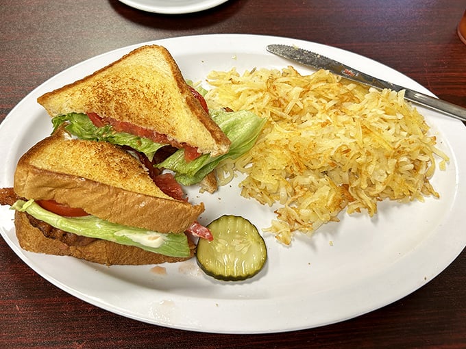 The BLT gets the royal treatment here—golden toast, garden-fresh veggies, and hash browns that glisten like edible sunshine.