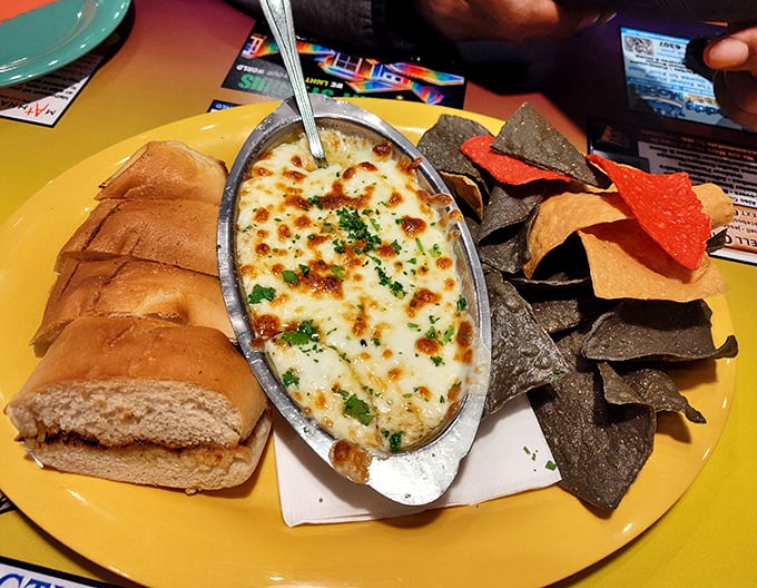 Bubbling cheese dip served with fresh bread and tortilla chips – because no coastal feast is complete without something to share.