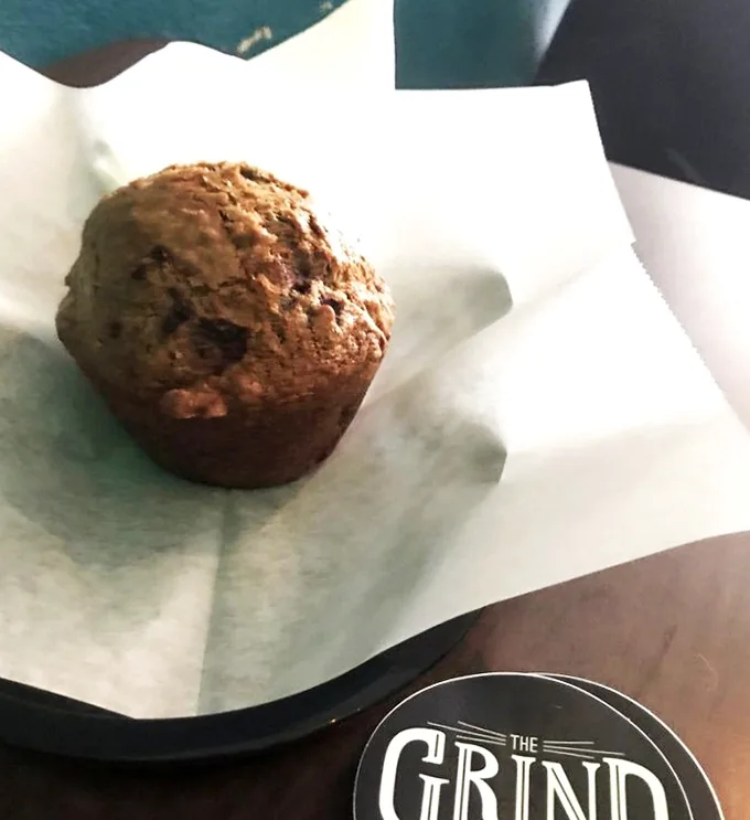 A humble muffin that doesn't need to show off, sitting there knowing it's about to become the highlight of someone's morning.