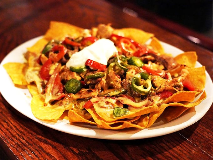 These nachos are playing the "loaded" game at championship levels. Every chip gets its fair share of toppings—the hallmark of nacho engineering excellence.