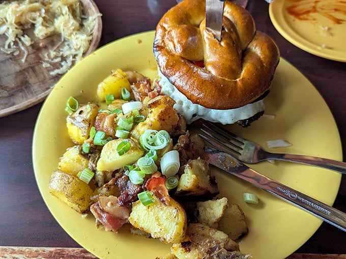 A pretzel crowning German potato salad like edible royalty – proof that carbs really do go better when paired with more carbs.