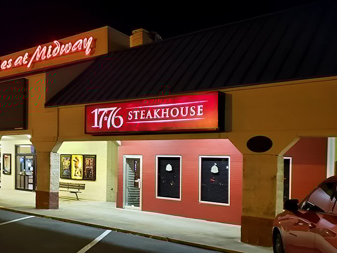 The illuminated sign of 1776 Steakhouse glows like a beacon in the night, calling all patriots of proper beef preparation.