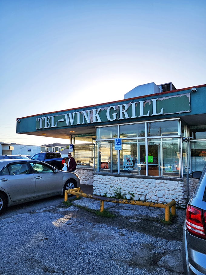 The sun setting behind Tel-Wink's sign feels symbolic—some places just shine brighter when most restaurants are calling it a day.