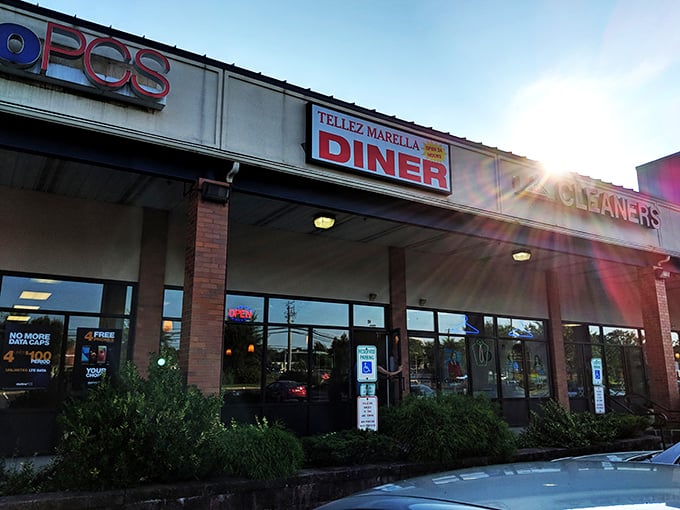 Tellez Marella Diner (evening view): As the sun sets, the "OPEN" sign glows like a lighthouse guiding hungry ships to safe, delicious harbor.