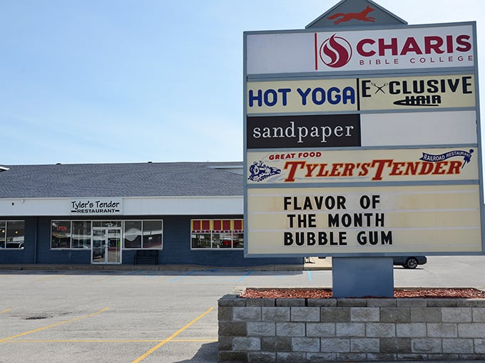 The sign boldly announces this month's flavor adventure – bubble gum – alongside other businesses in this strip mall.