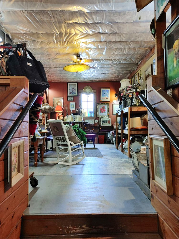 A corridor of possibility. That white rocking chair isn't just furniture – it's someone's future reading nook waiting to be discovered.