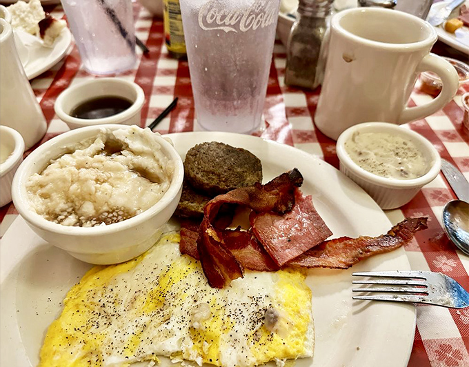 Grits, eggs, bacon, and sausage—the breakfast quartet that performs a symphony of flavor every morning at the Loveless.