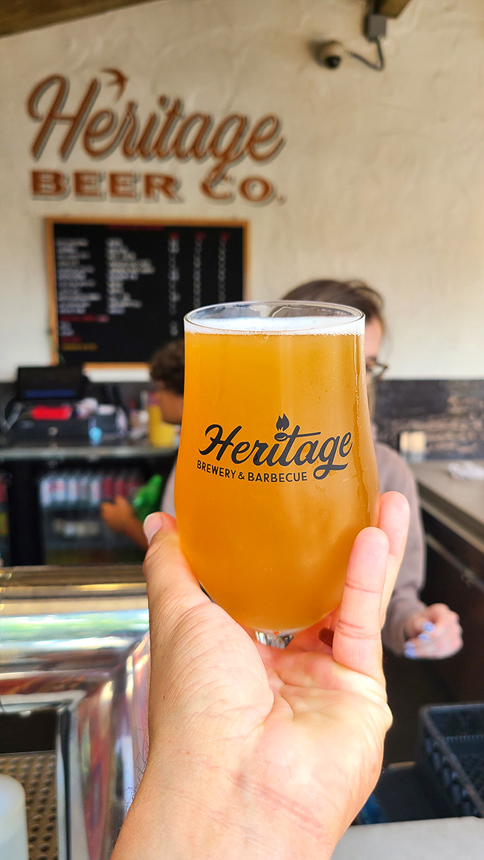 Liquid gold to wash down smoky treasures. This craft beer isn't just a beverage—it's the perfect dance partner for Heritage's meaty masterpieces.