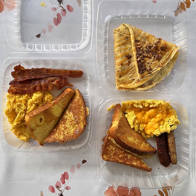Two breakfast dreams sharing one table: hearty morning fuel meets delicate crepe artistry in perfect harmony together.