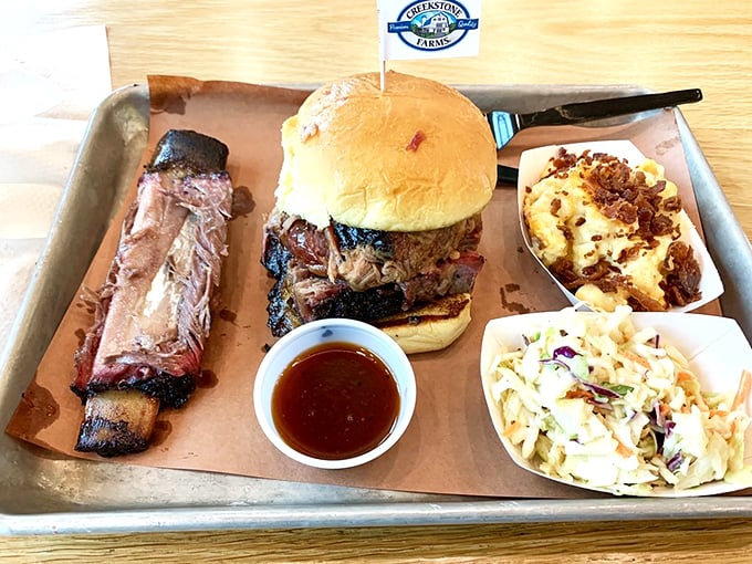 This isn't just a sandwich—it's an architectural achievement. Load-bearing bun supports a skyscraper of smoked goodness that's worth every messy bite.