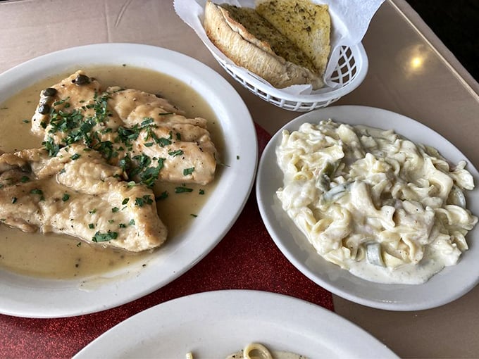 Chicken piccata swimming in a buttery lemon sauce alongside pasta salad. A perfect marriage of tangy and creamy that dances on your palate.